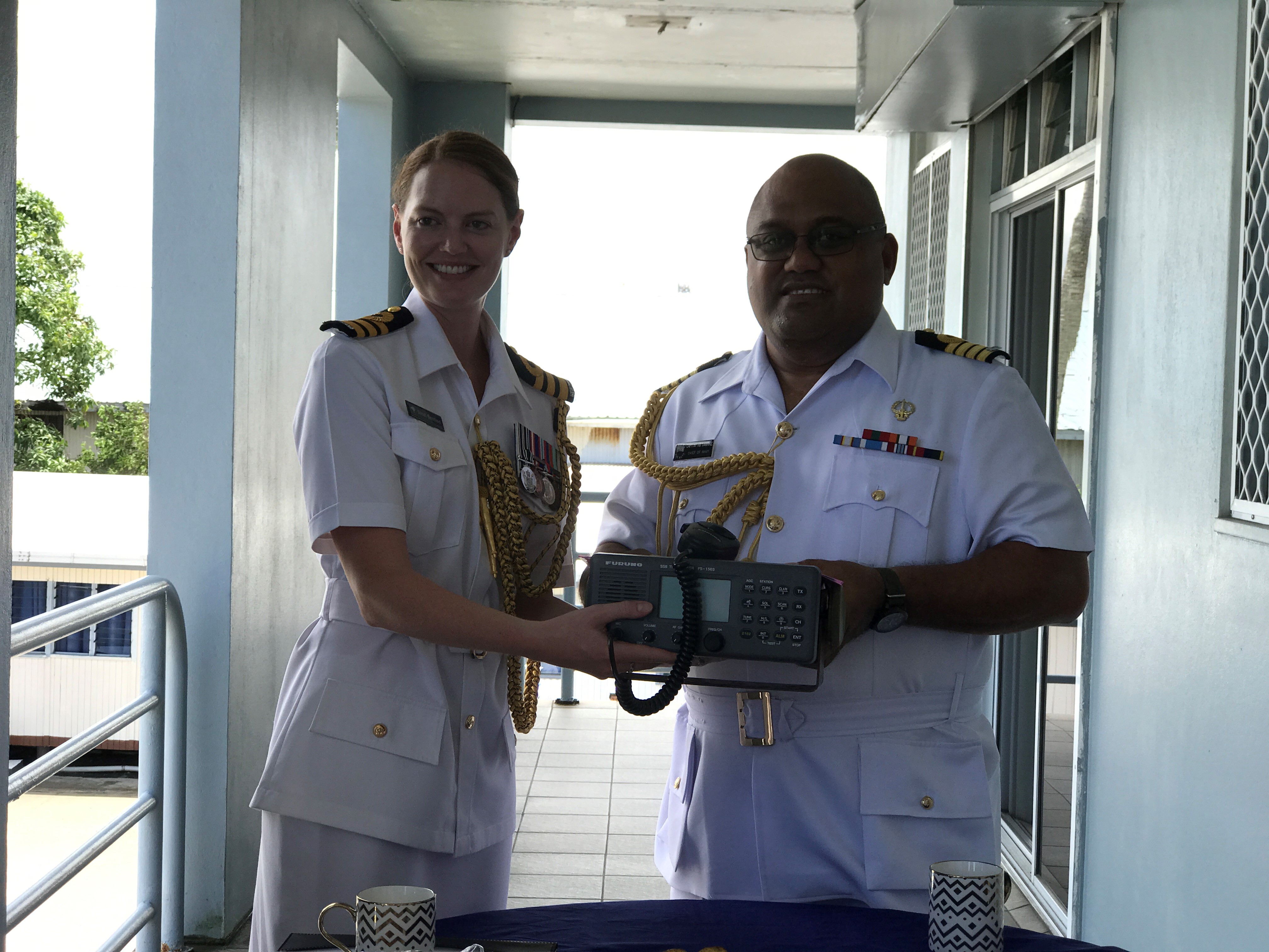 New Zealand Defence Force hands over a marine radiotelephone to the ...