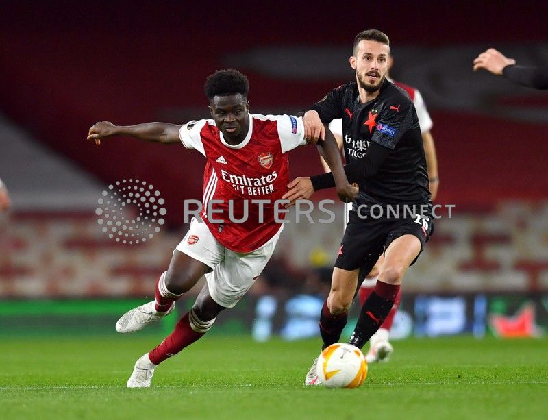 Arsenal's injury woes deepen as Saka limps off with thigh issue - The ...