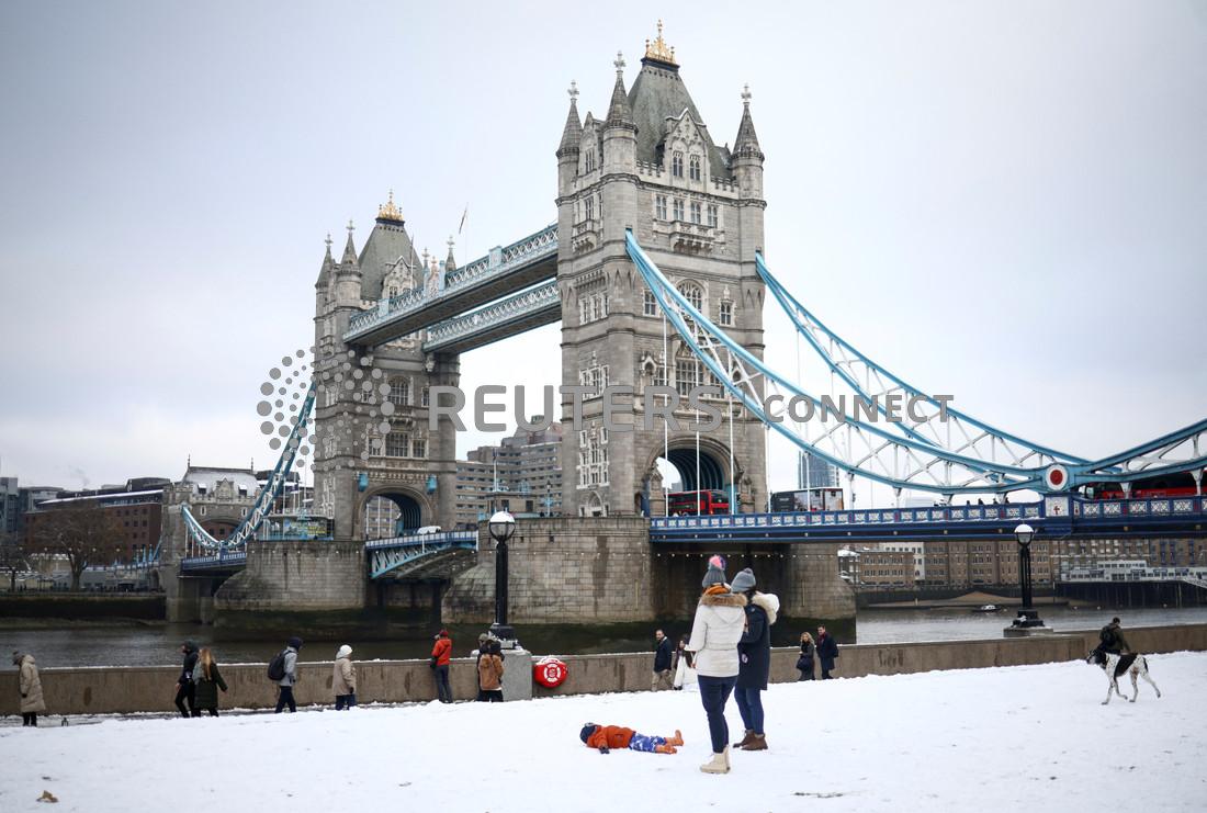 Heavy snow disrupts UK travel; three boys die after falling into lake ...