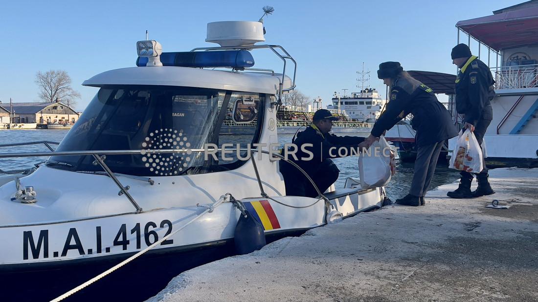 Christmas gifts come by boat to isolated Romanian Danube Delta villages ...