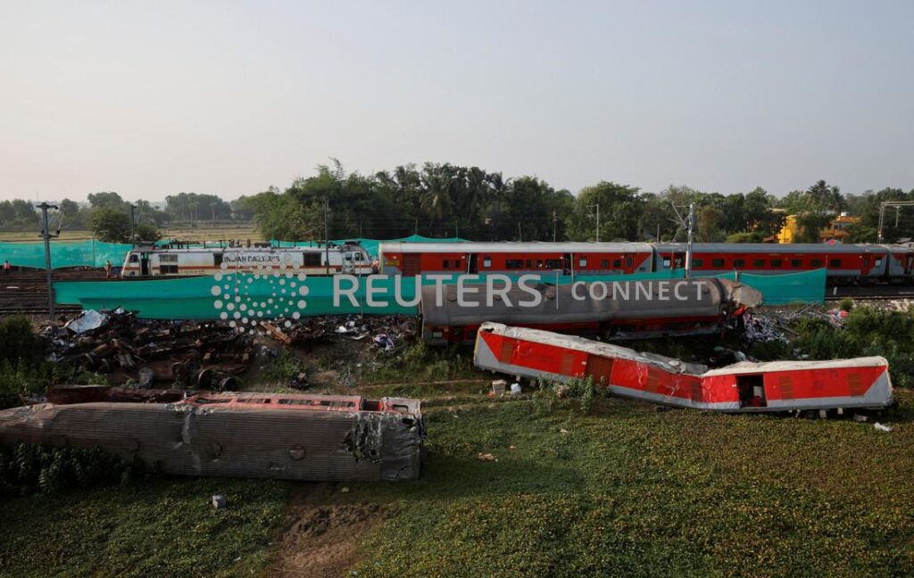 India investigates rail disaster as trains crawl through crash site ...