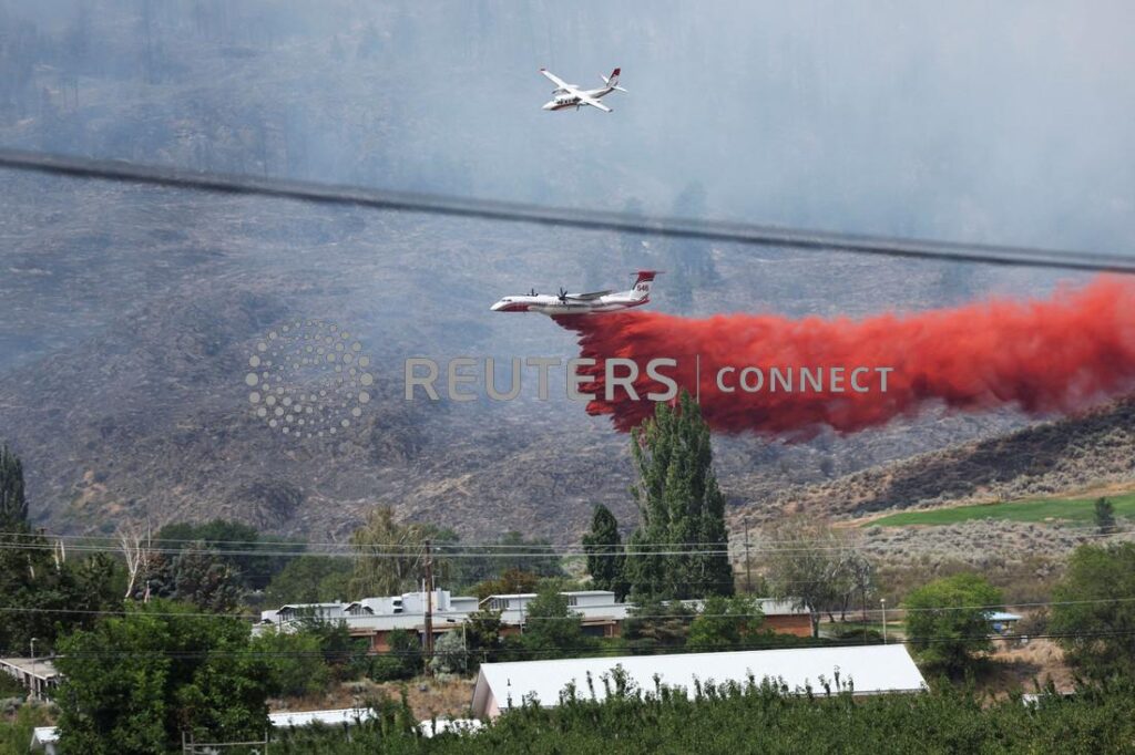 Evacuation order issued for western Canadian town as wildfire crosses ...