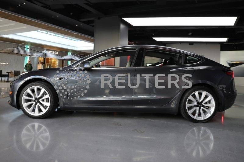 Uber says it's working with Tesla to boost EV adoption among drivers ...