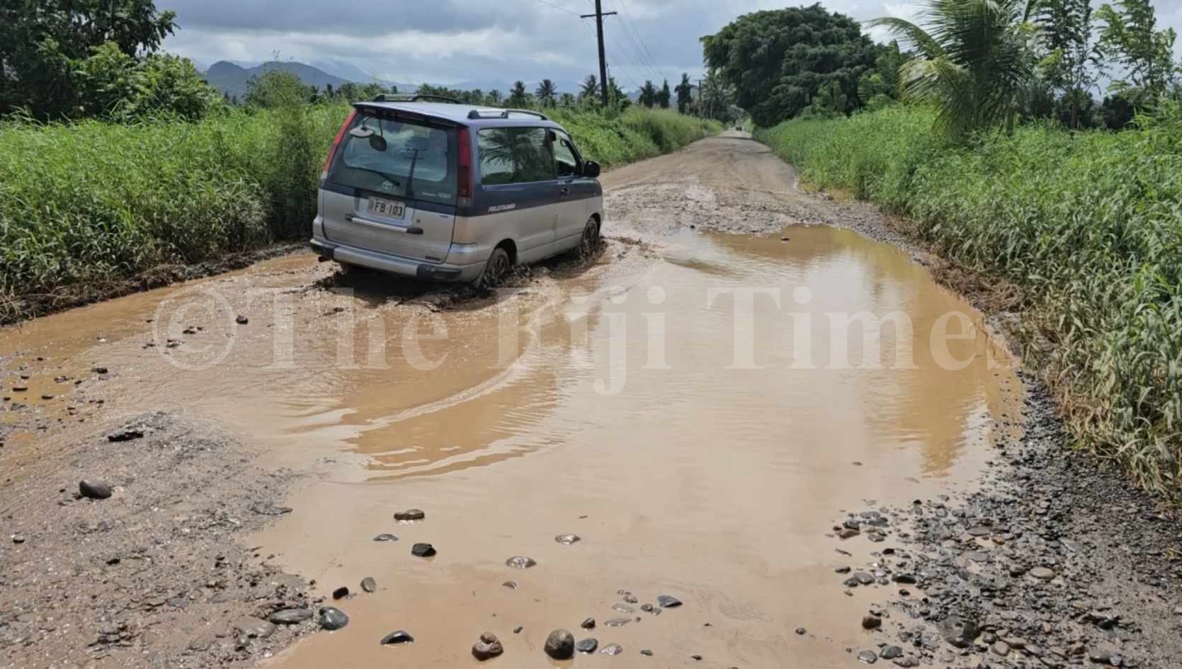 Pothole Peril: Residents have trouble getting home due to poor road ...