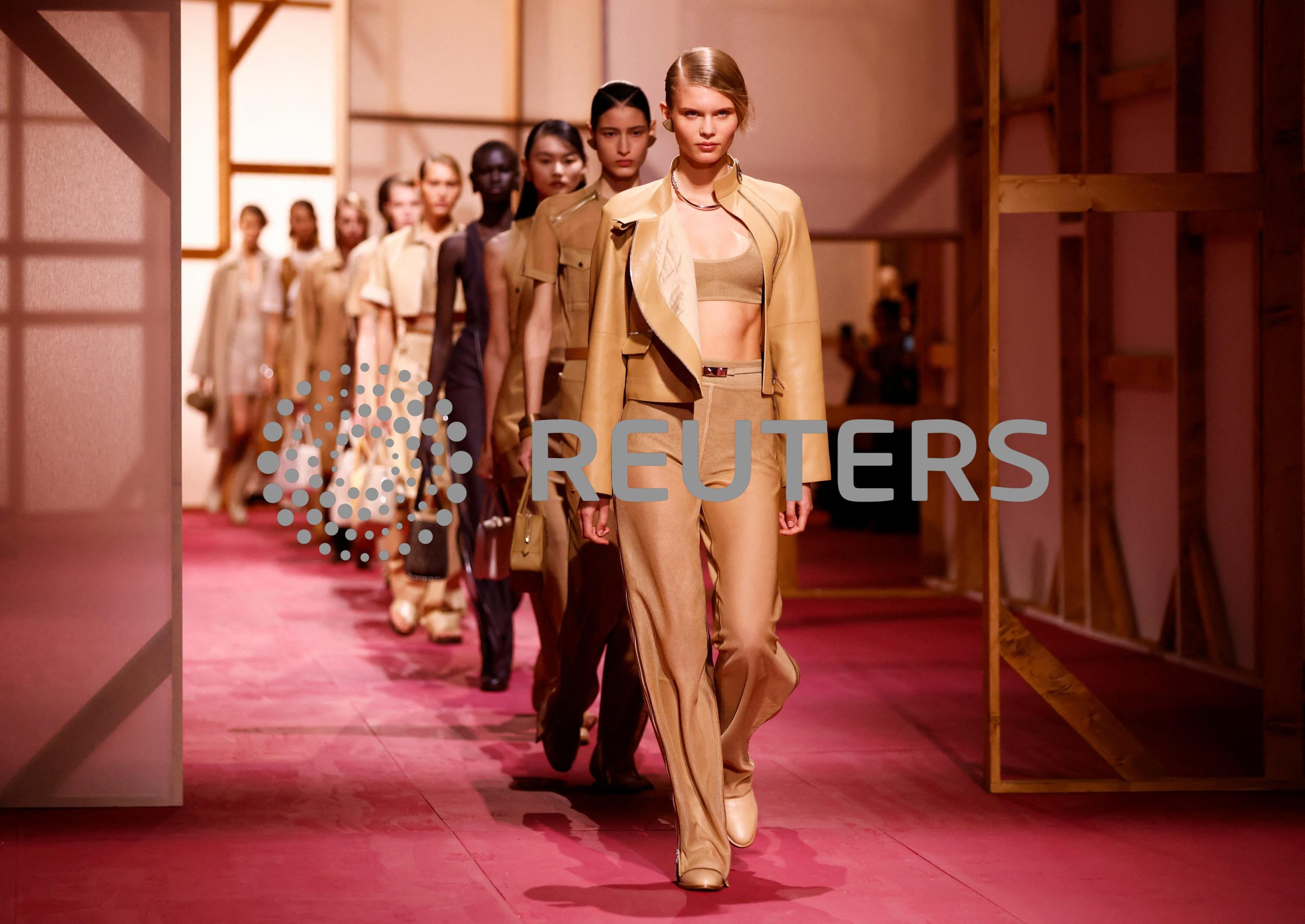 Tan leather and trio of protestors parade Hermes catwalk in Paris - The ...