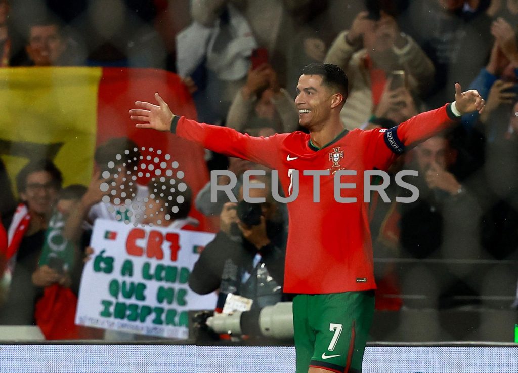 Soccer-Ronaldo double helps Portugal reach quarters with 5-1 Poland ...