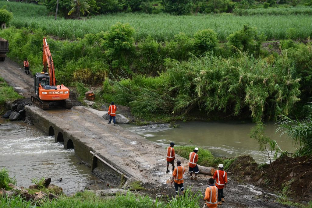 Community unites to clear bridge - The Fiji Times
