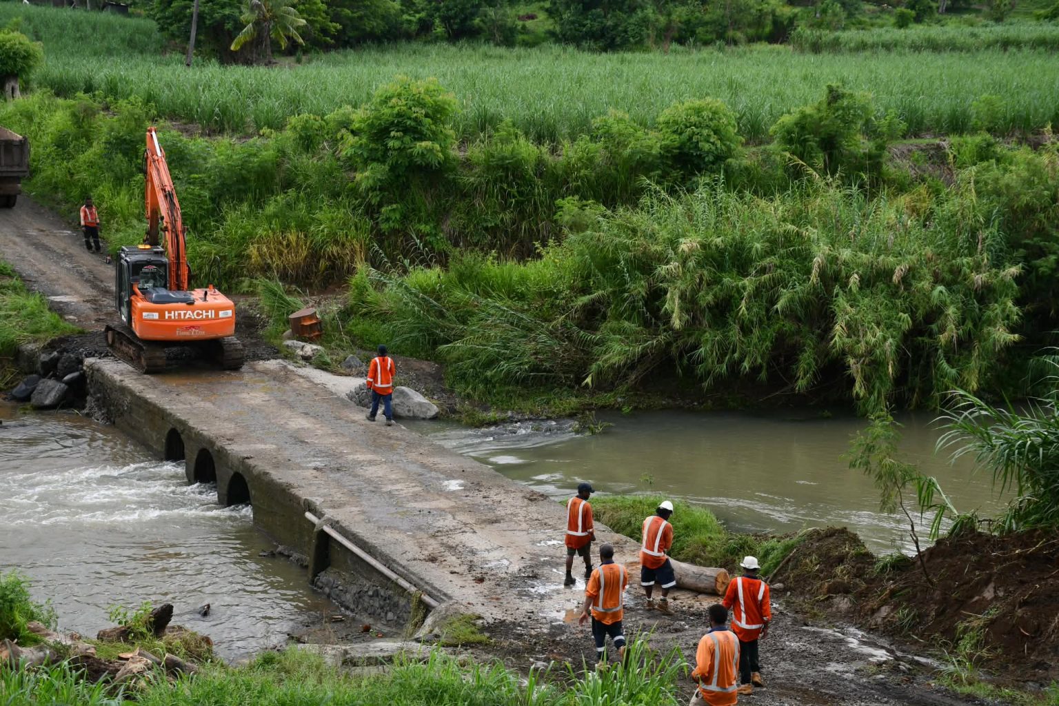 Community unites to clear bridge - The Fiji Times